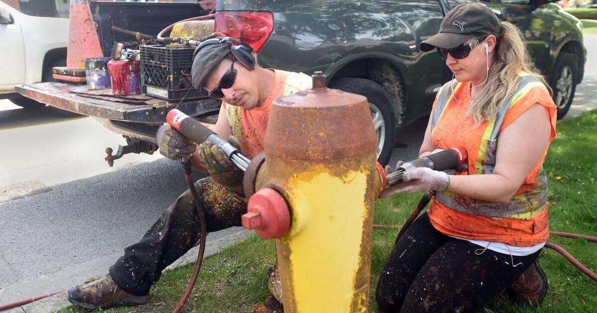 Kitchener couple are painting the town red (and yellow)