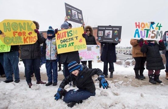 Hundreds protest autism funding changes in Kitchener