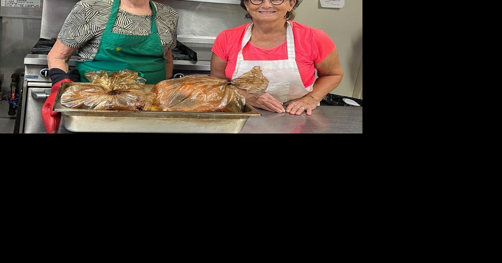 Volunteers at Trinity Community Table prepare to serve Thanksgiving meal