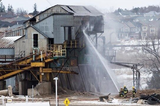 Firefighters work to control a fire at Dufferin Aggregate