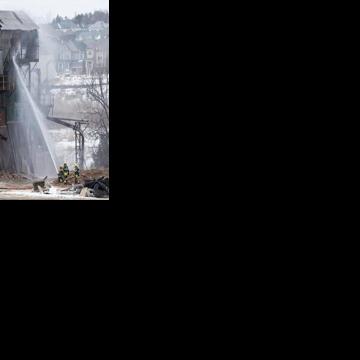 Firefighters work to control a fire at Dufferin Aggregate