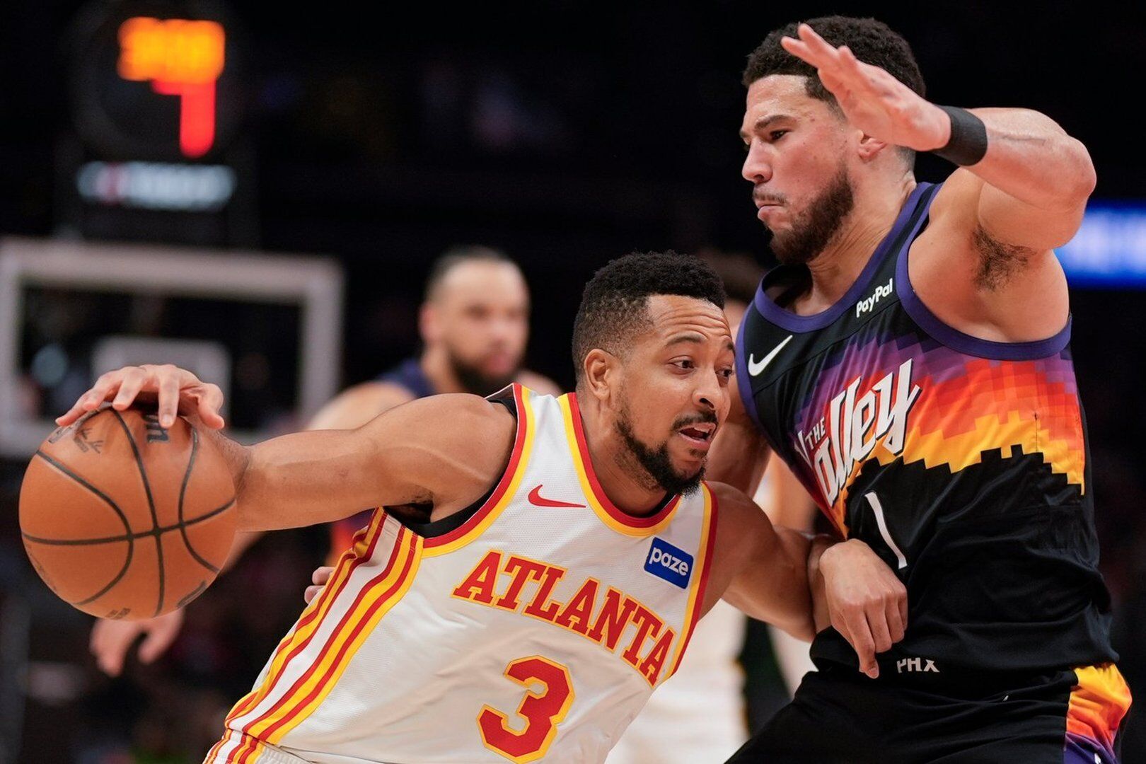 Suns' Devin Booker rolls his ankle and Jalen Green also hurt in loss to Hawks