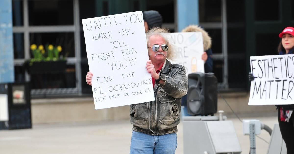 Dozens gather in Waterloo square to protest lockdown order