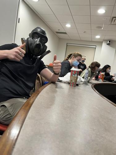 Laurier student wears lettuce, scuba and gas masks to protest ongoing ...