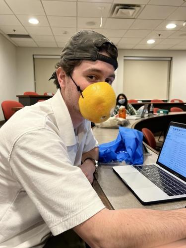 Laurier student wears lettuce, scuba and gas masks to protest ongoing ...