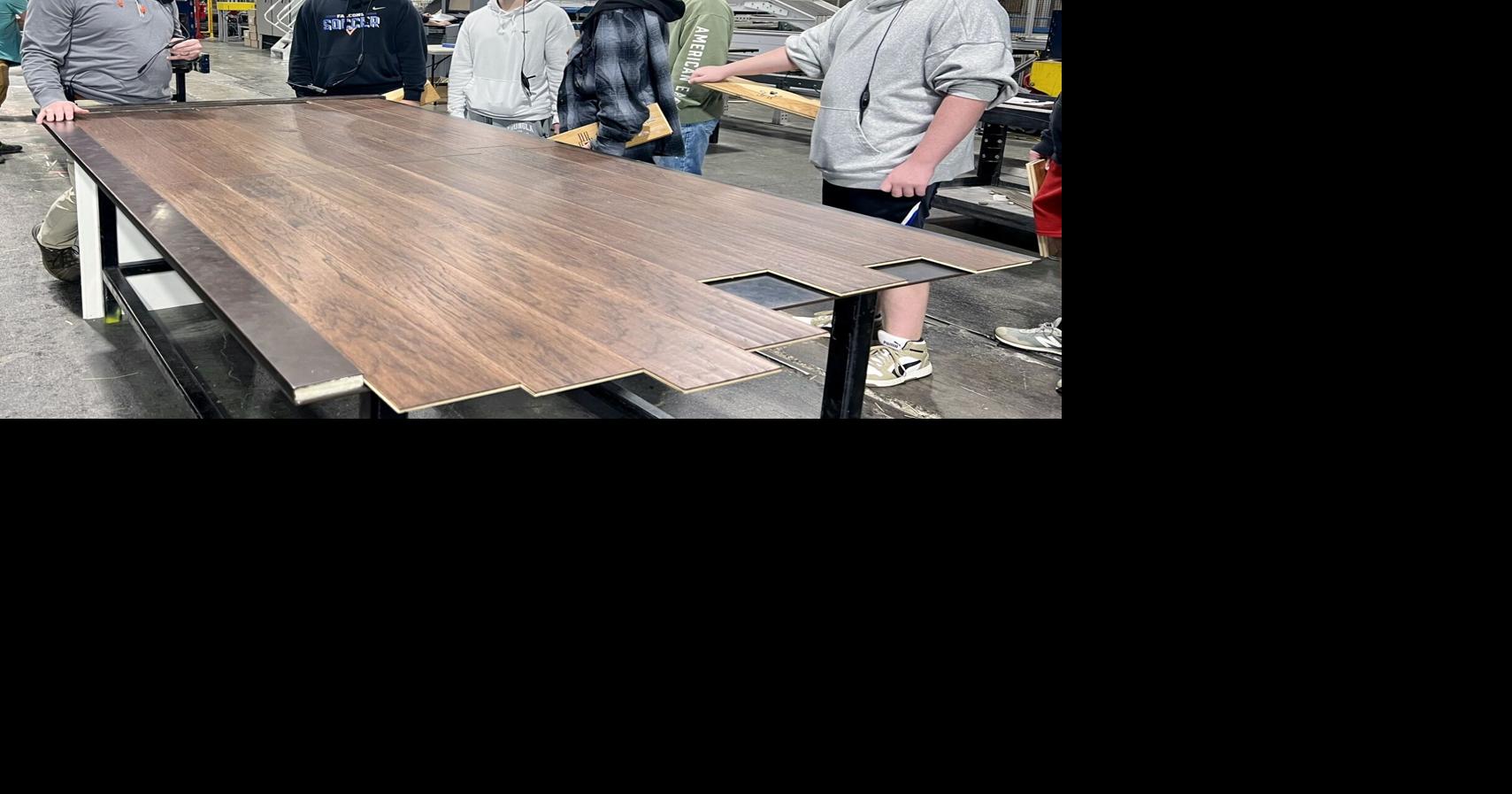 Volunteer students learn about manufacturing during Mullican Flooring ...