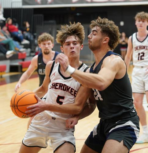 08) Landon Jeffers meets a Bulldog defender. | | therogersvillereview.com