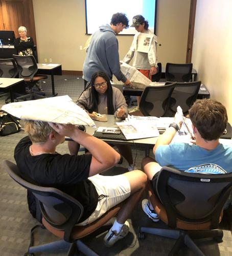 Tusculum students develop fashion from newspaper in teamwork exercise ...