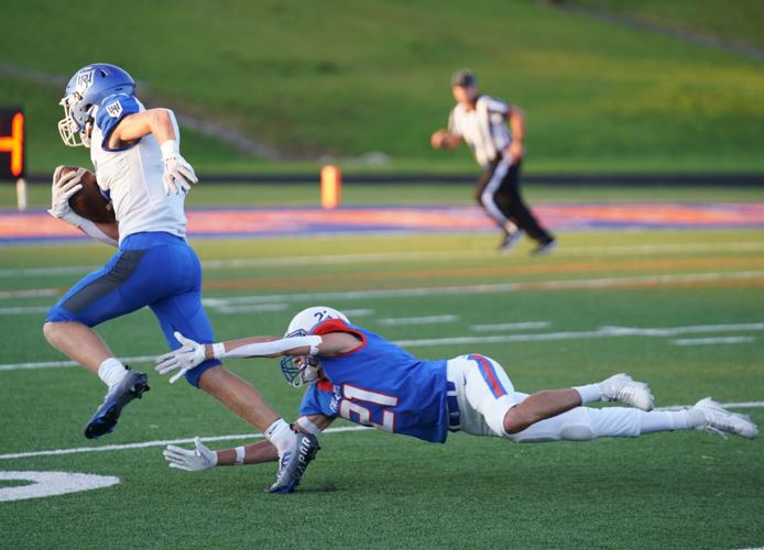 PHOTO GALLERY: Wolves roll past Falcons | Sports | therogersvillereview.com
