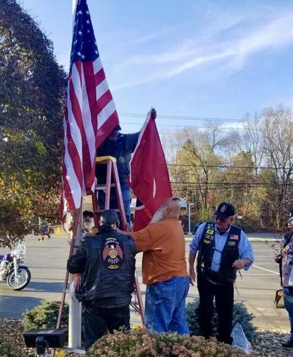 American Legion Post 21 'Legion Riders' replace flags at funeral home ...