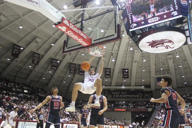 Salukis storm past Screaming Eagles in white-out game | Sports ...