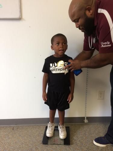 Mobile dentists exam, clean teeth of youth at community Back-to-School ...