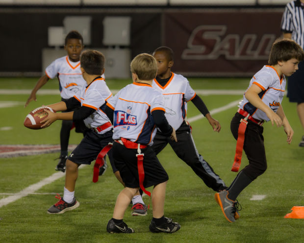 Junior football players get rare chance