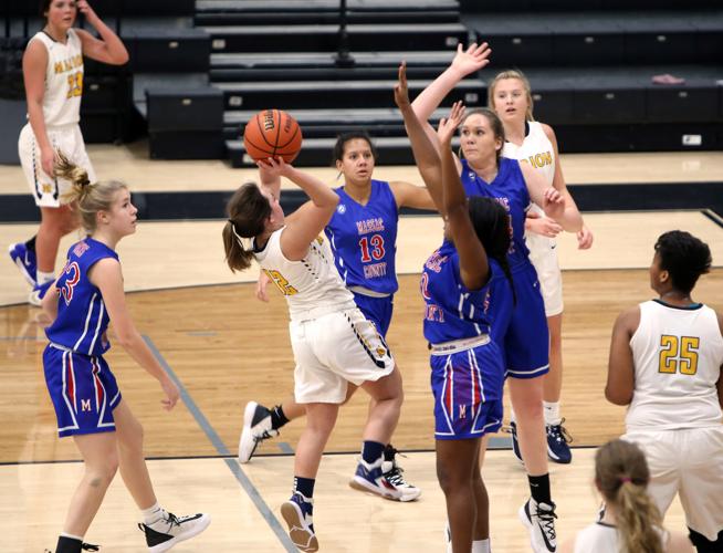 Girls Basketball | Massac County holds off Marion at Carbondale ...