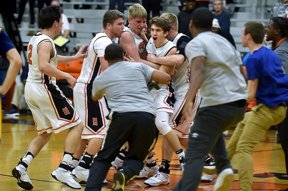 Photos: Herrin Tigers Defeat Marion Wildcats in Basketball