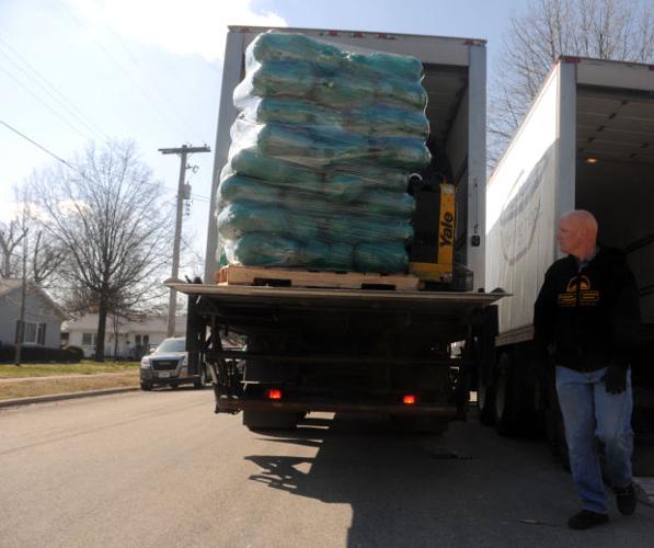 Drive in for a hand up; Families in need get some help | Local News ...