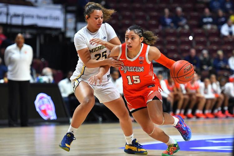 Delfosse scores 21, leads No. 6 Michigan past Syracuse in Hall of Fame ...