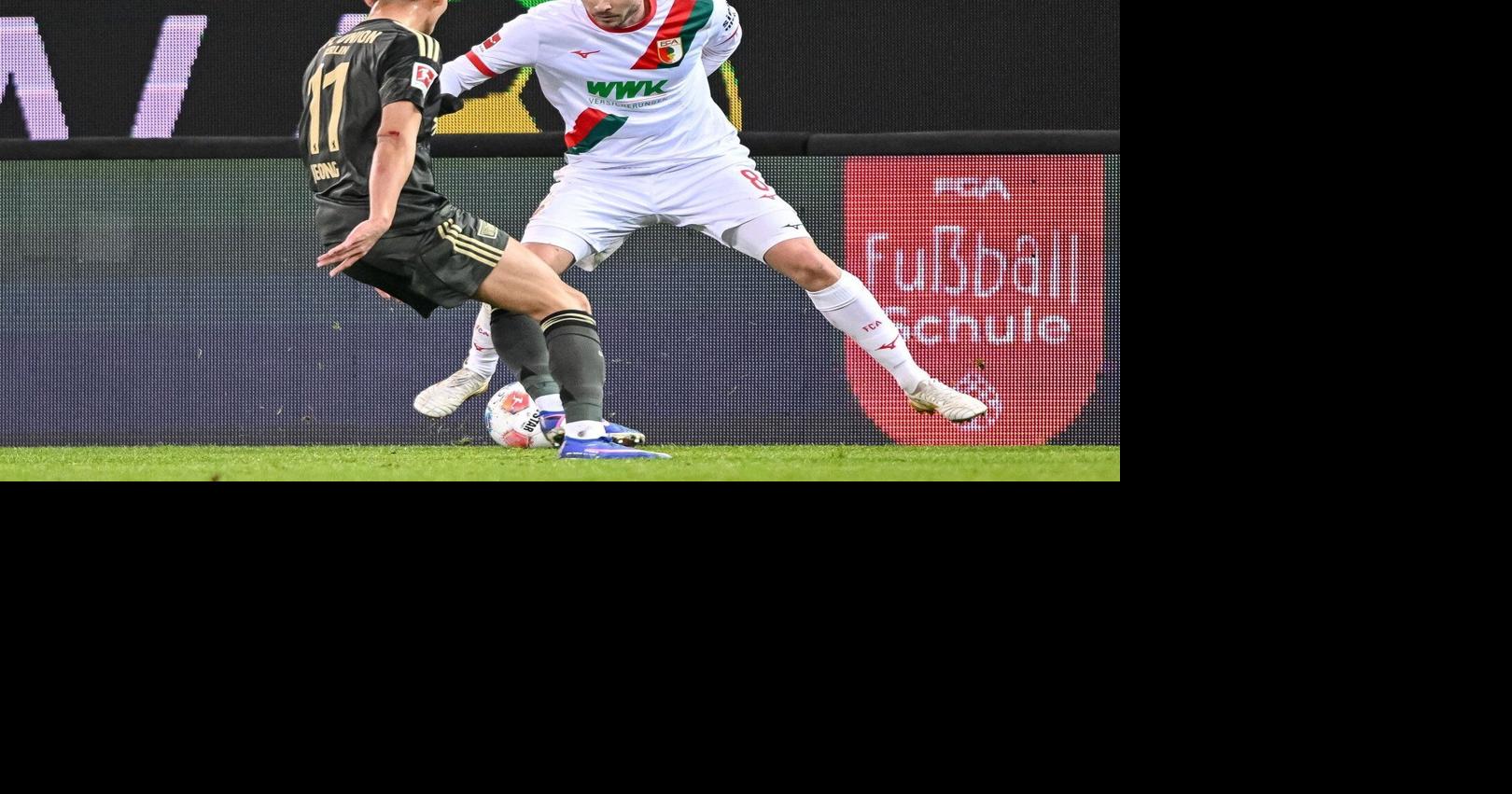 Fan protest against kickoff times interrupts Bundesliga game between ...