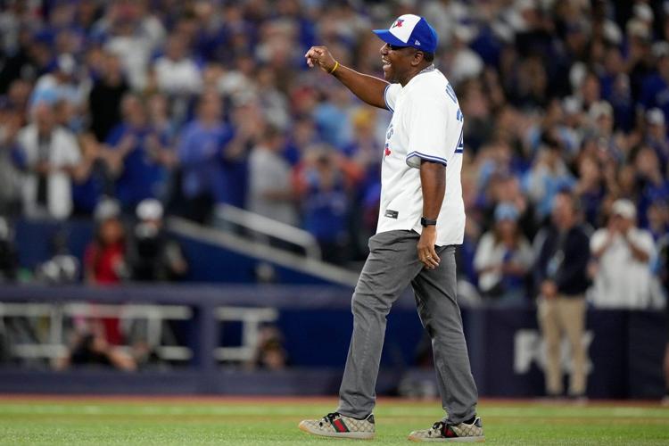 Joe Carter wears Blue Jays' home run jacket after throwing first pitch ...