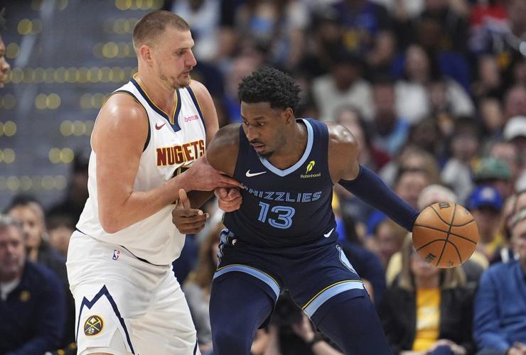 Jokic clinches triple-double average, Murray returns in the Nuggets' 117-109 win over the Grizzlies