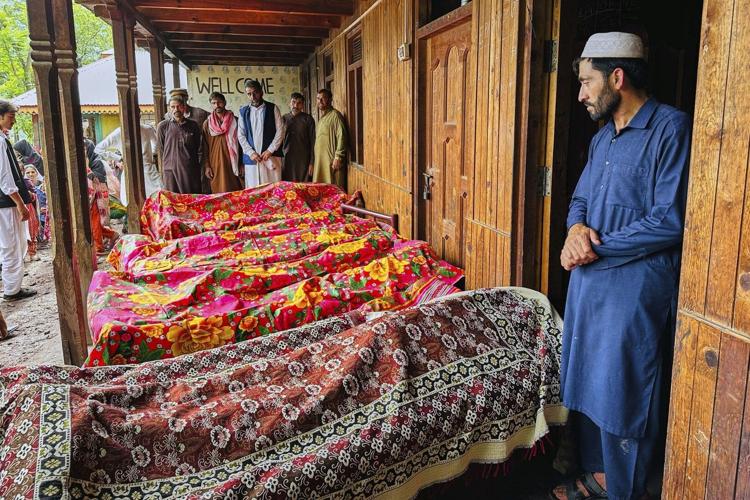 Photos of mourners and searches for the missing from flash floods in ...