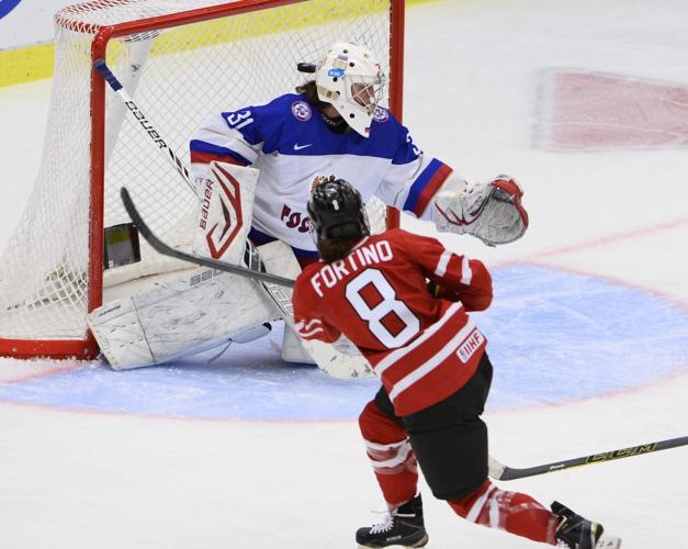 Canadian hockey star’s last Olympic leap — with a new flag