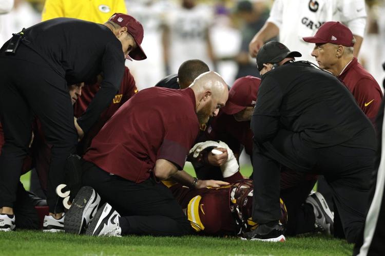 Commanders defensive end Deatrich Wise Jr. carted off the field with ...