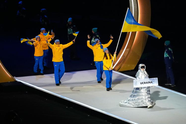 Russian woman carried Ukraine placard at Winter Olympics opening ceremony