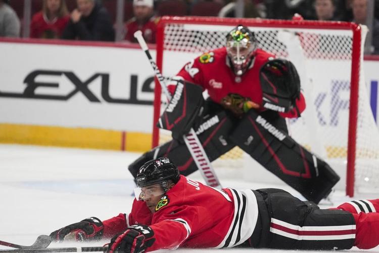 Bertuzzi helps Chicago beat San Jose 4-2 in the Blackhawks' home opener
