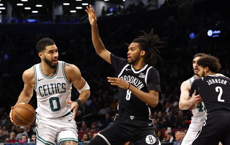 Porzingis scores 24 in his return to help the Celtics hold on to beat the Nets 115-113
