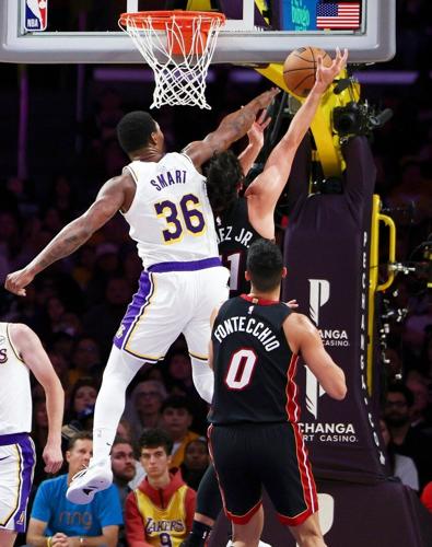 Lakers beat Heat 130-120 behind Doncic's triple-double