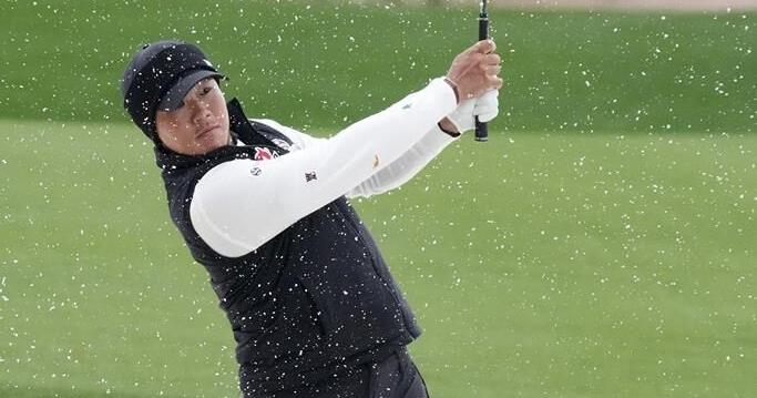 Taylor takes 1-shot lead into Sunday at raucous, waterlogged Phoenix Open