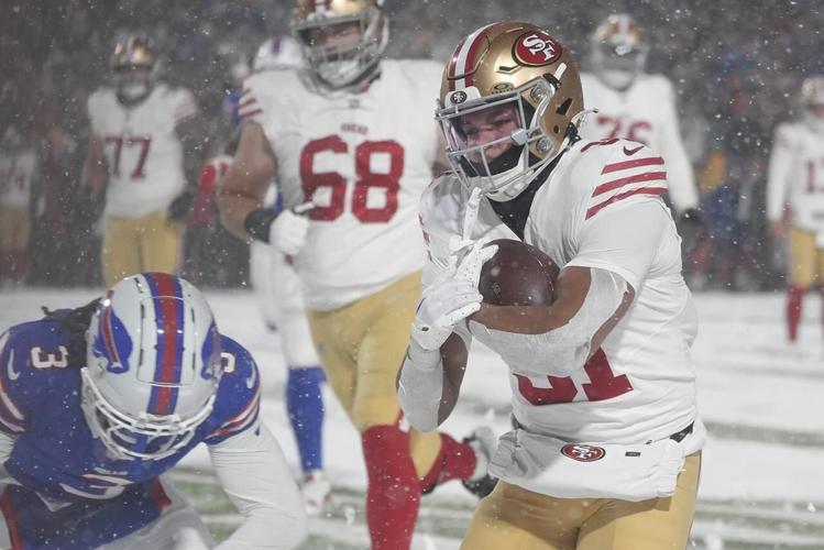 Josh Allen has TDs passing, rushing and receiving as Bills rout 49ers 35-10 in snow, clinch AFC East