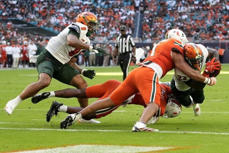 Cam Ward passes for 3 TDs, runs for another and No. 12 Miami rolls past ...
