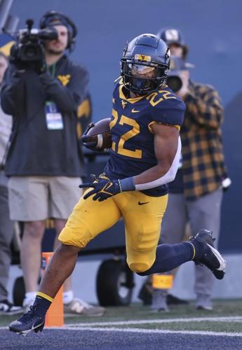 Jahiem White and Garrett Greene run wild in West Virginia's 42-21 romp ...