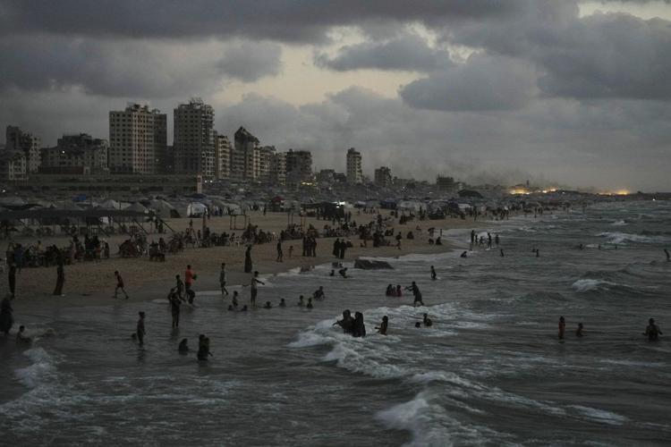 Photos in Gaza City, where the beach offers fleeting respite as war and ...
