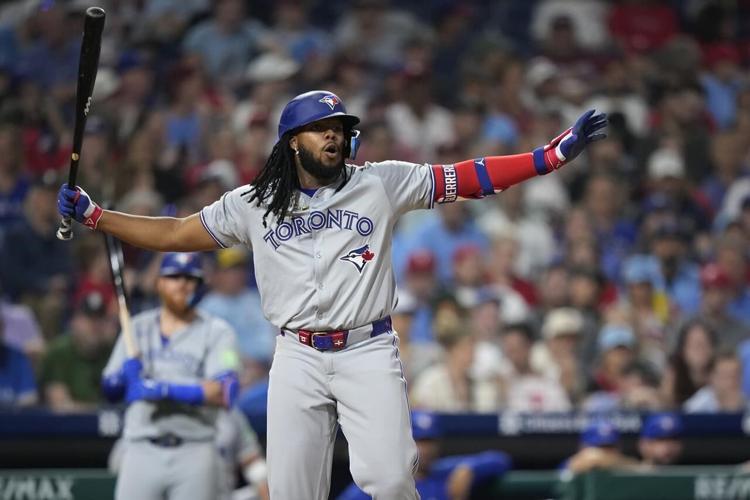Harper hits grand slam, streaking Phillies rout Blue Jays 10-1