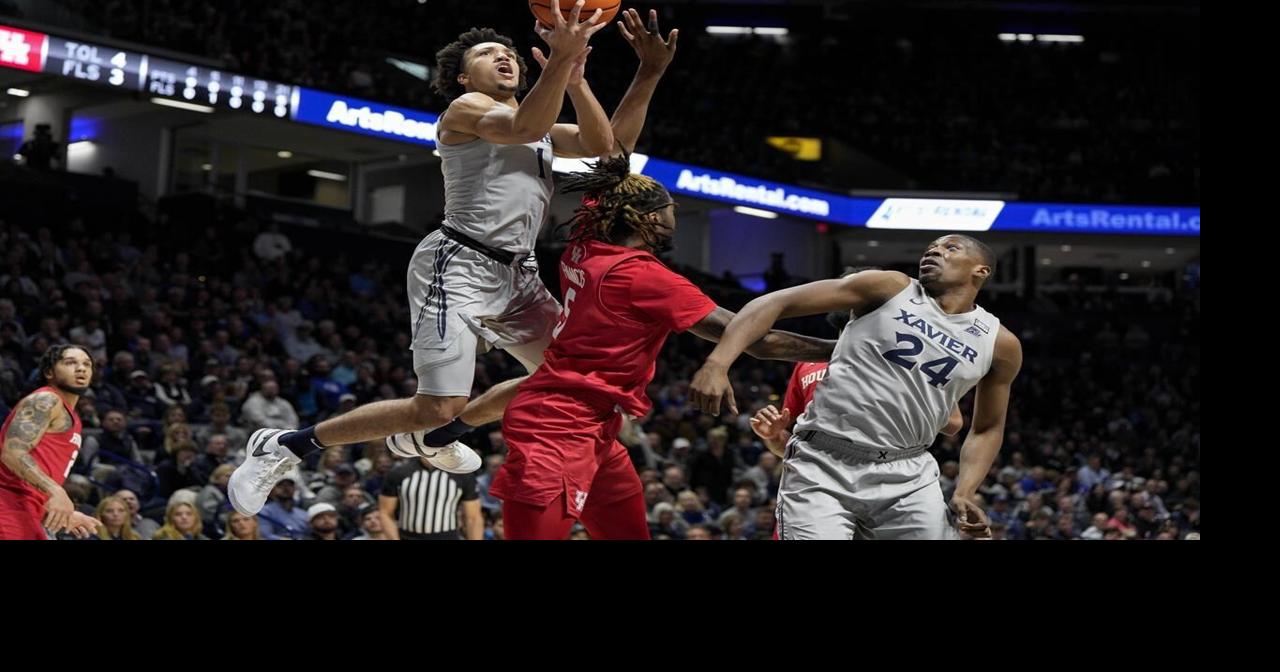 L.J. Cryer scores 23 points in No. 6 Houston's 66-60 victory over Xavier