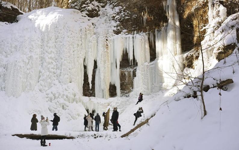 Climbers part of the spectacle at frozen Ancaster waterfall