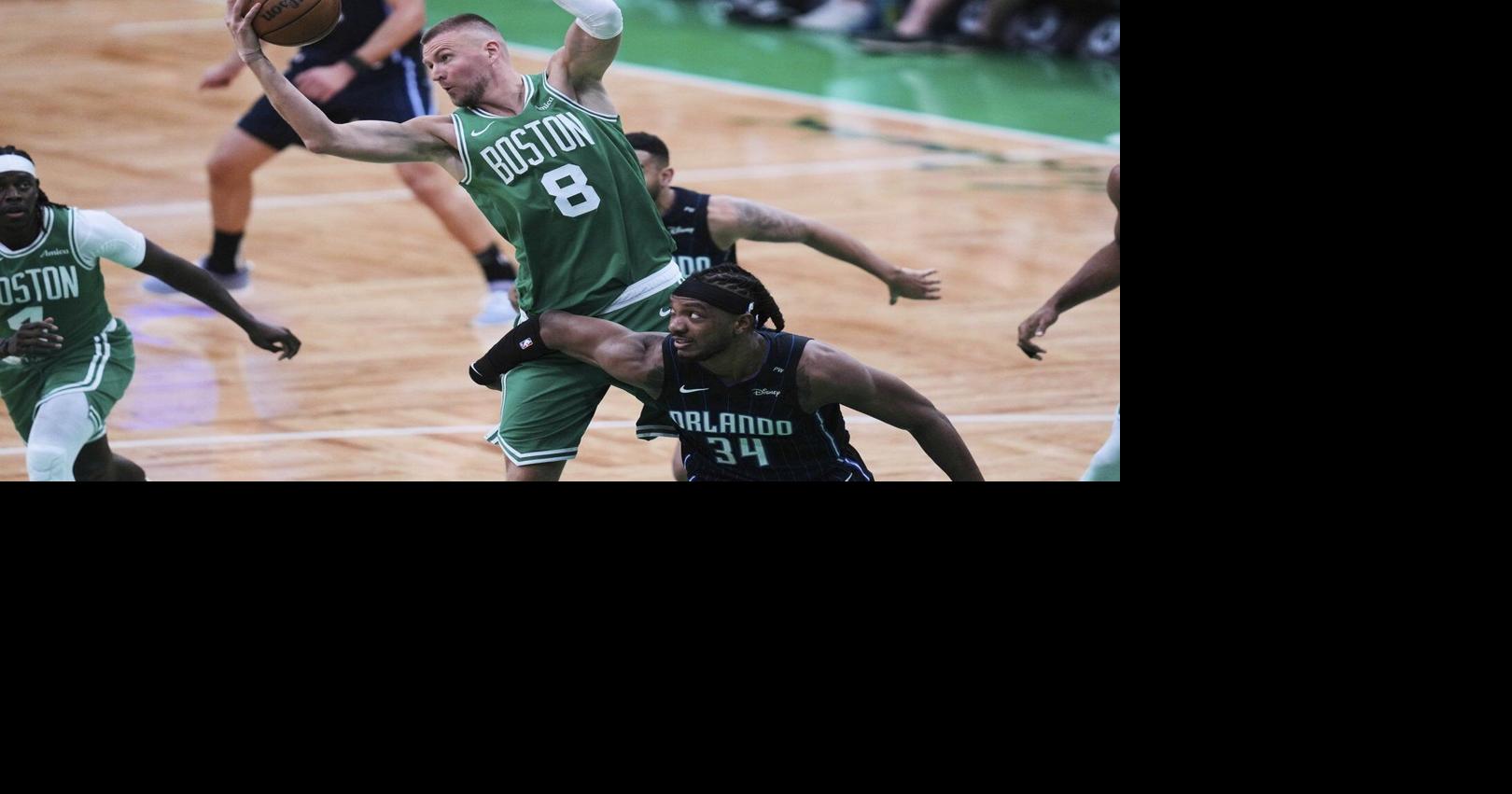 Celtics' Kristaps Porzingis elbowed in forehead, gushes blood, returns ...