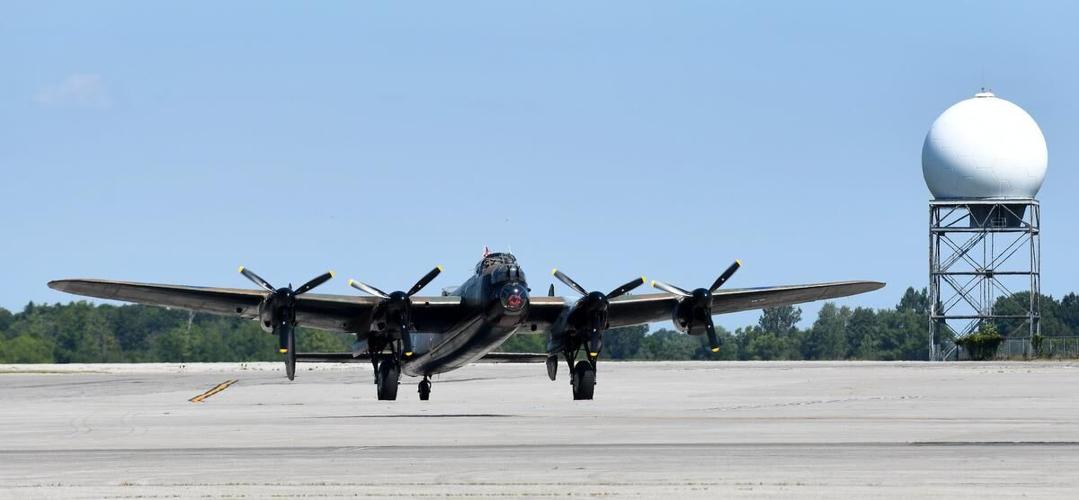 Restored Lancaster bomber takes maiden flight in front of a crowd of 20,000