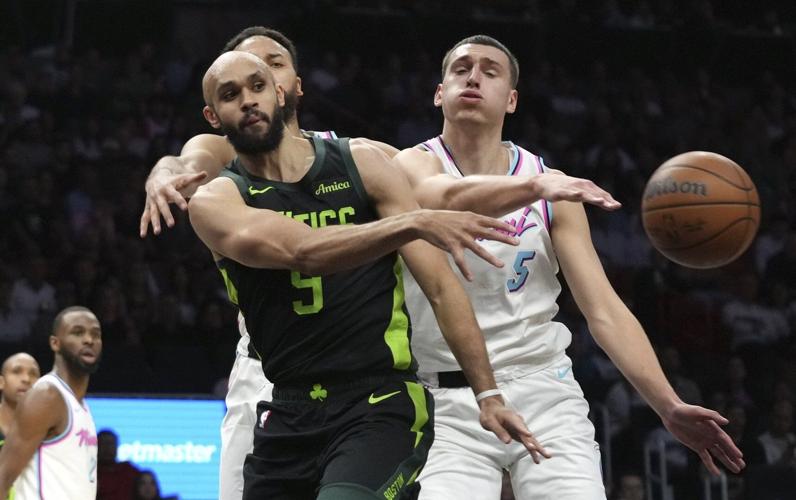Jayson Tatum scores 33, Celtics hold Heat to 34% shooting and roll to 103-85 win