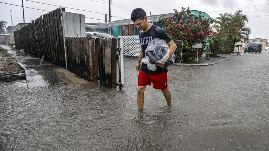 Tropical rainstorms in South Florida lead to flight delays and streets ...