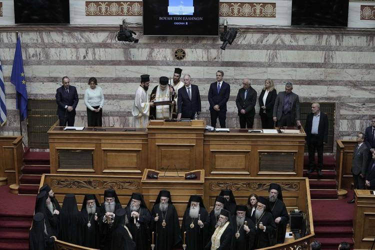 A veteran conservative lawmaker is sworn in as Greece’s new president
