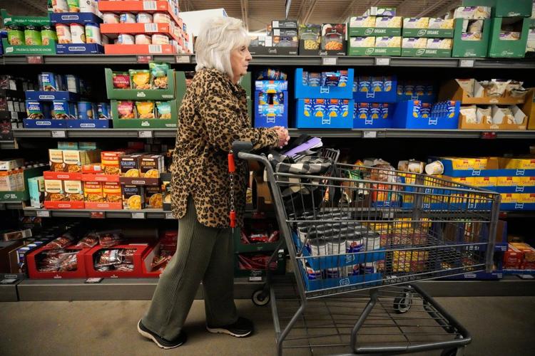 A cafeteria worker prepares a Thanksgiving meal to feed hundreds