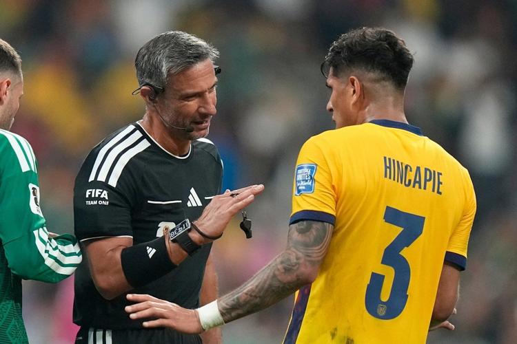 Why are World Cup refs giving red cards to players covering their ...