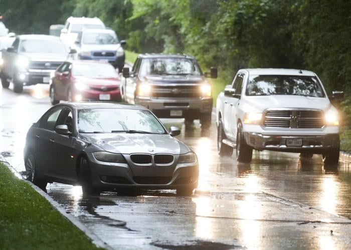Heavy rains near Houston close schools and flood roadways as officials ...
