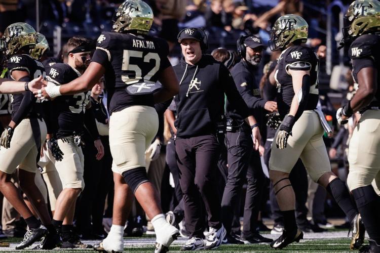 Ashford throws for three TDs as Wake Forest whips Delaware 52-14