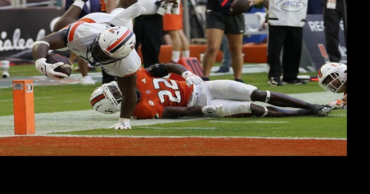 UVA's Mike Hollins, Michigan's Blake Corum, Holy Cross' Jacob Dobbs win ...