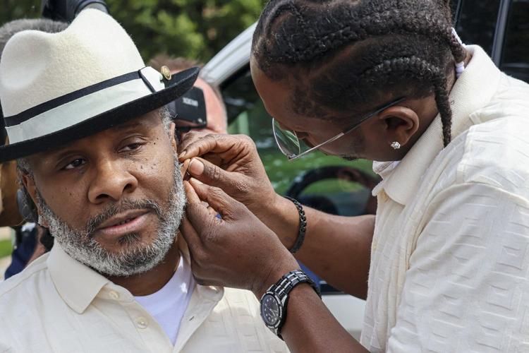 A Minnesota man imprisoned for 27 years is free after a key witness says she committed the murder